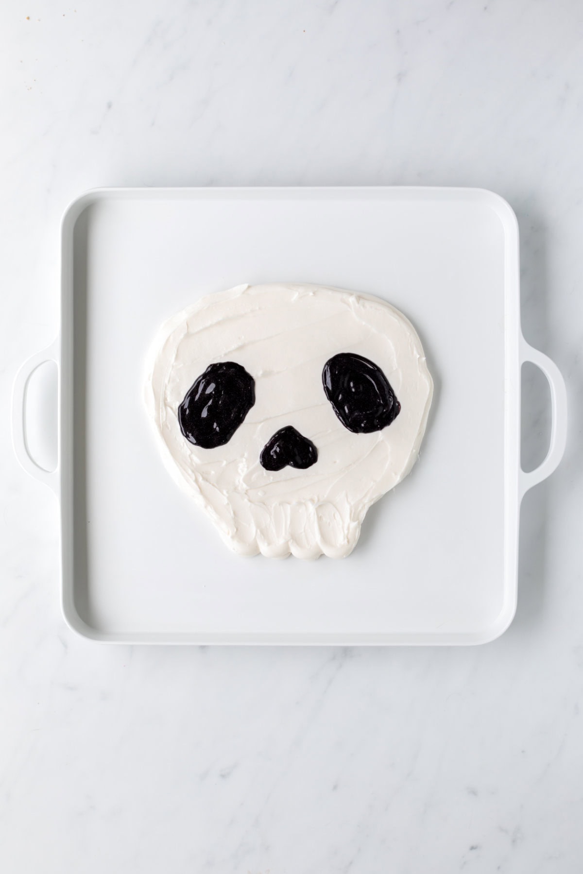Easy & Spooky Halloween Skull Frosting Board Dessert Recipe
